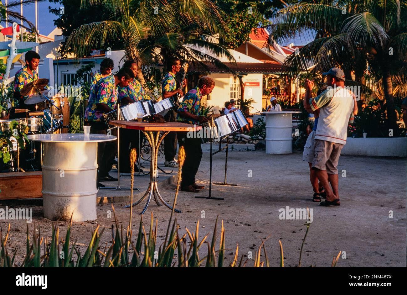 Steel drum band plays at seaside resort in Bonaire Stock Photo - Alamy