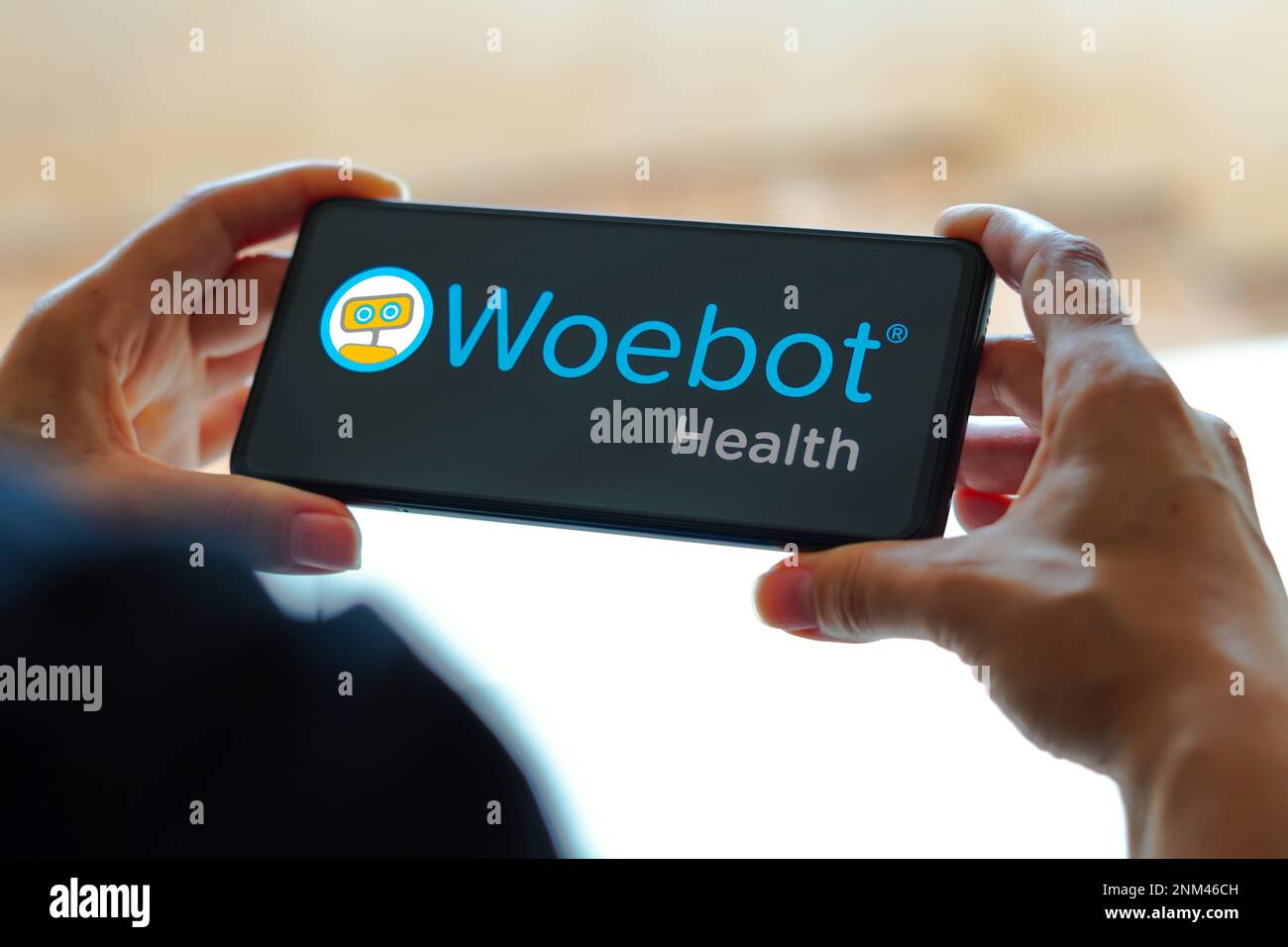 In this photo illustration the Woebot Health logo seen displayed on a smartphone Stock Photo - Alamy