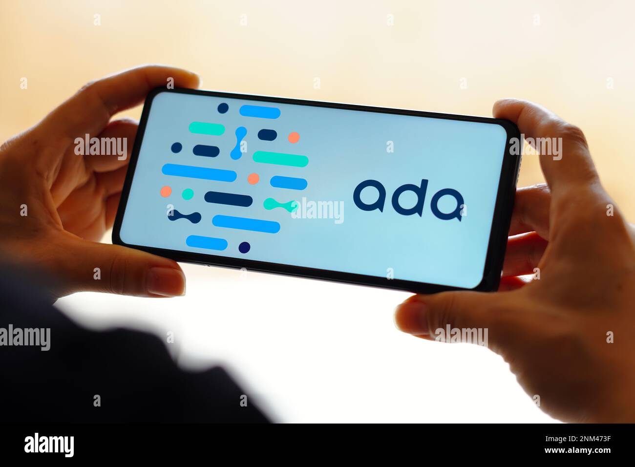 In this photo illustration the Ada Health logo seen displayed on a ...
