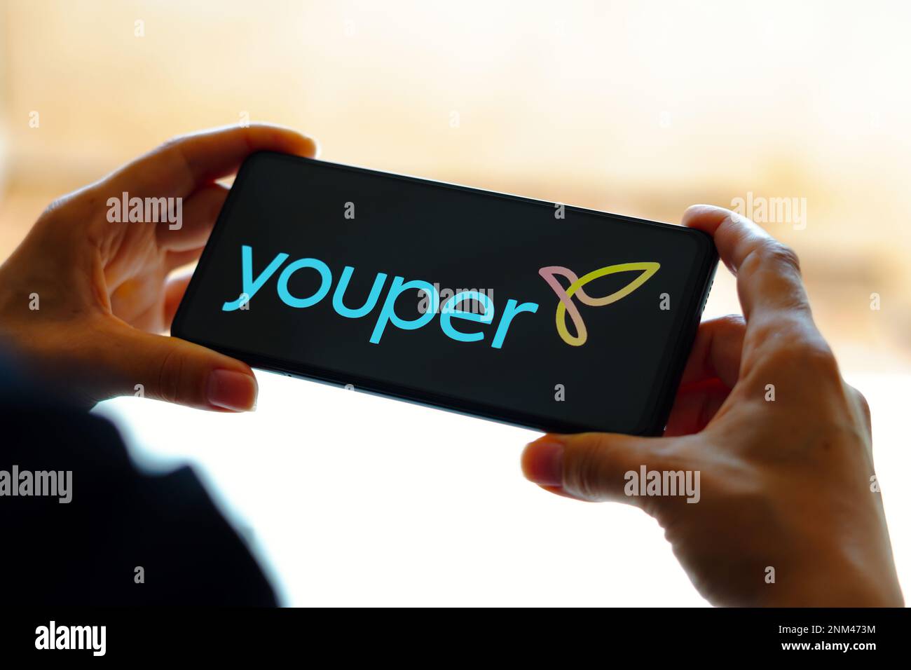 In this photo illustration the Youper logo seen displayed on a ...
