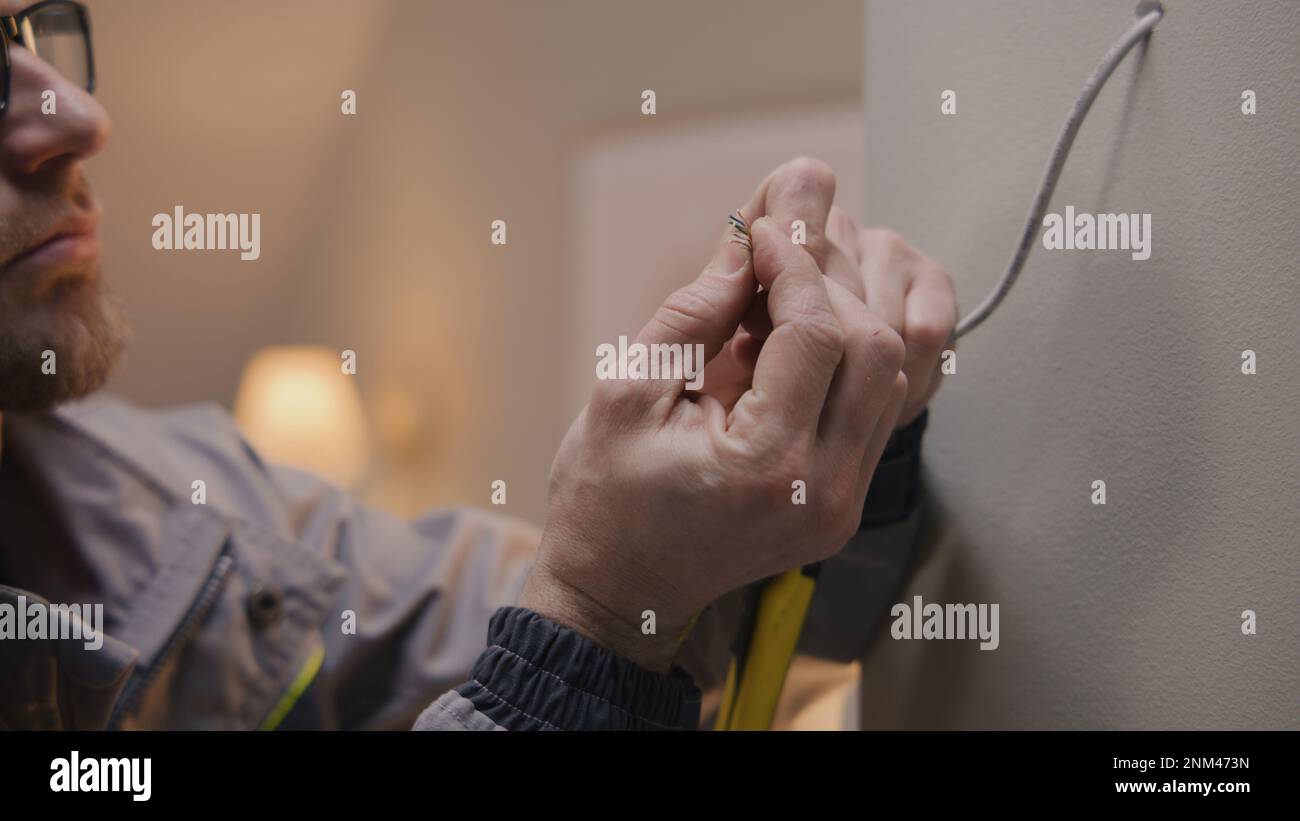 Electrician removes insulation from hi-res stock photography and images ...