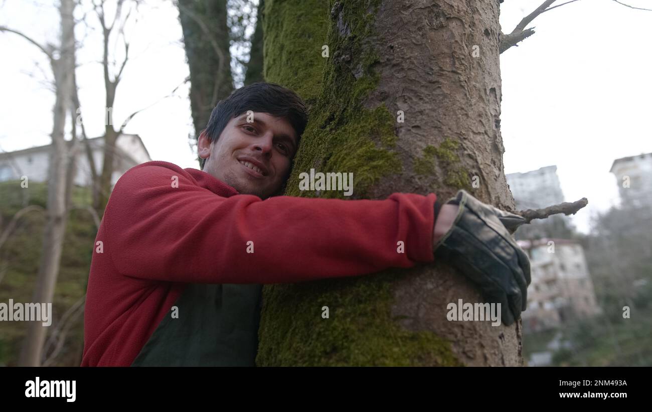 Embracing Nature Young Male Farmer Who Wraps Trees and Brings Joy to ...
