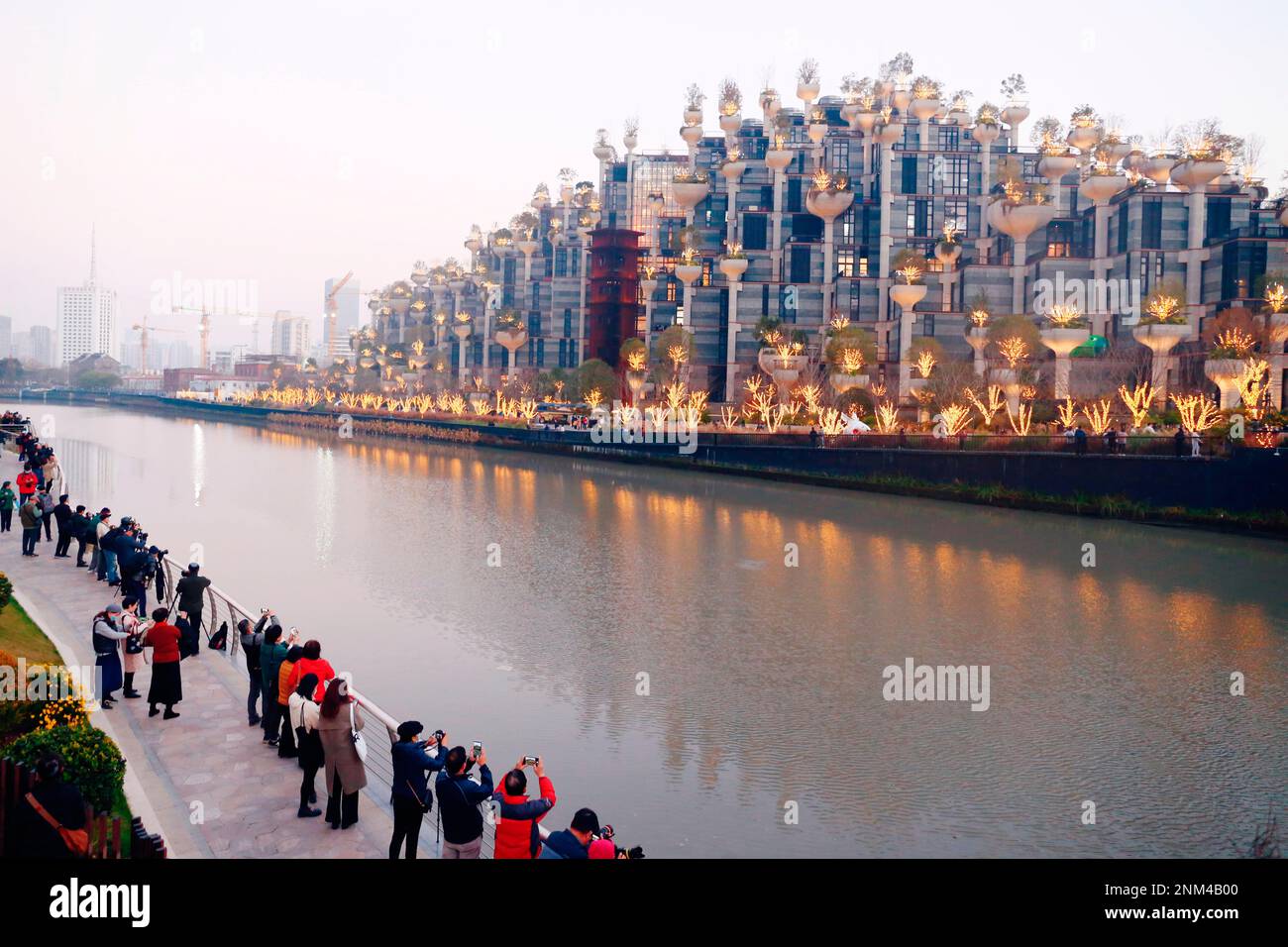 People take photos of the "1000 Trees" shopping mall designed by ...