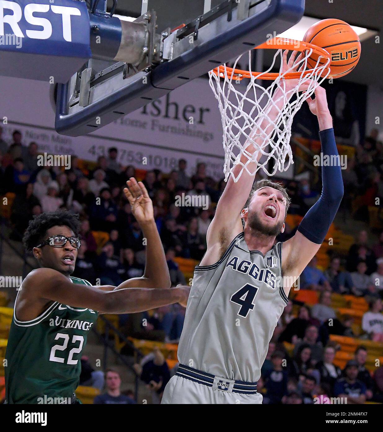 Utah State forward Brandon Horvath (4) is fouled by Portland State ...