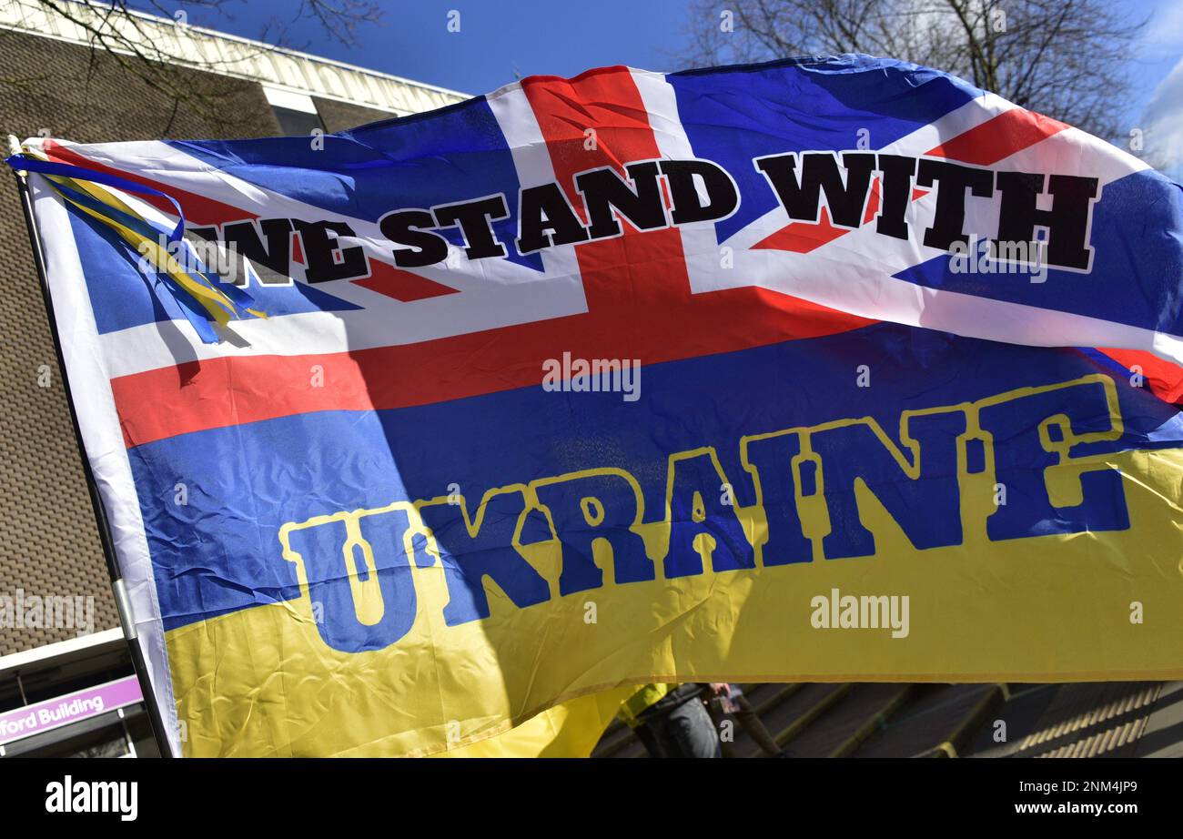 Manchester, UK, 24th February, 2023. A 'We stand with Ukraine' flag in ...