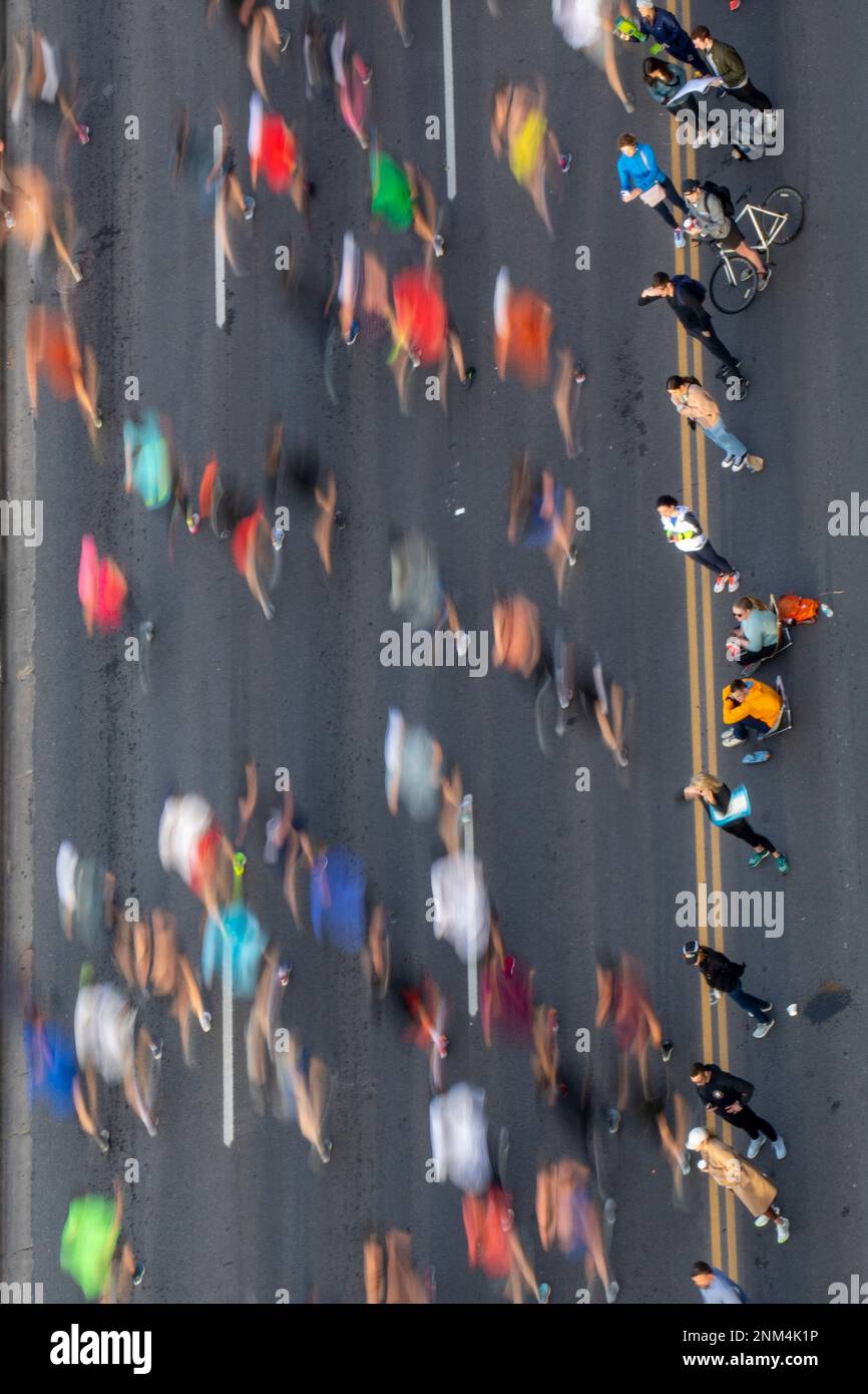 Overhead view of Austin marathon runners in motion on Cesar Chavez ...
