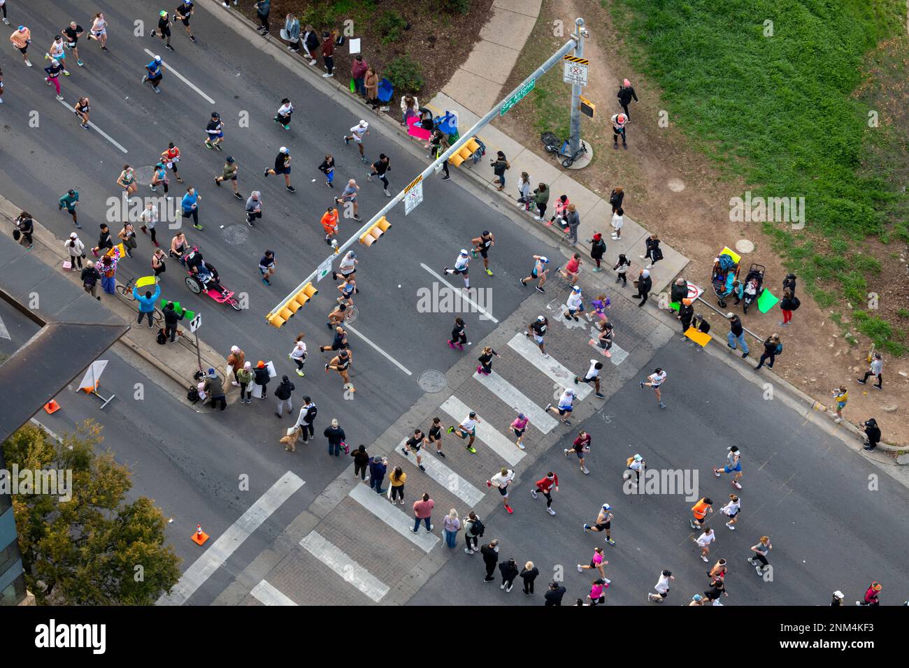 Overhead view of Austin marathon runners on Cesar Chavez Avenue in ...