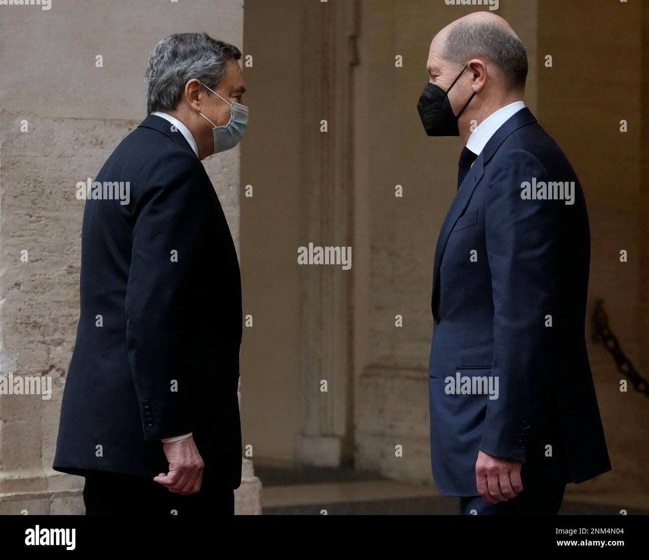 Italian Premier Mario Draghi, left, and German Chancellor Olaf Scholz ...