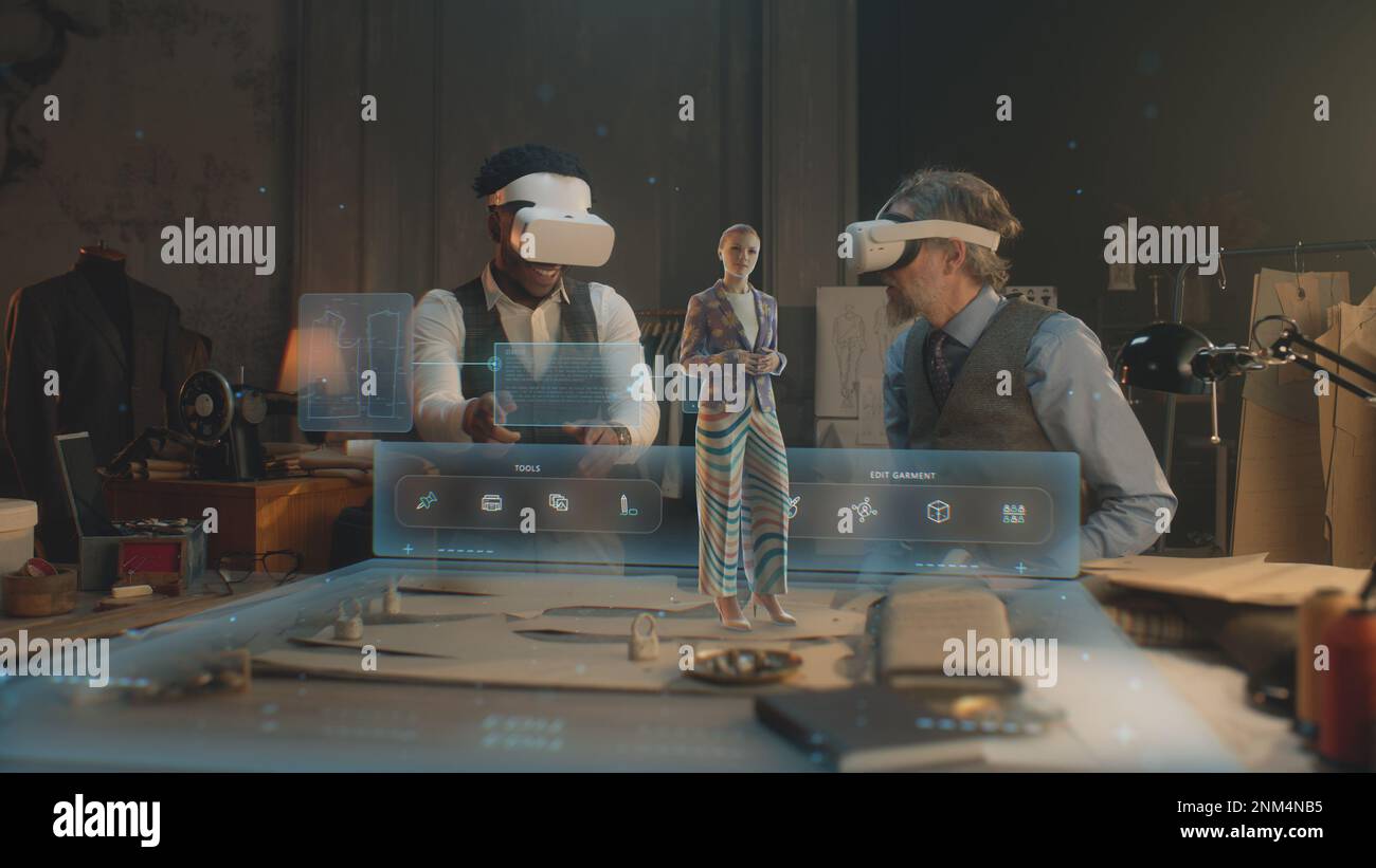 Two multi ethnic tailors in VR headsets in atelier. 3D female hologram ...
