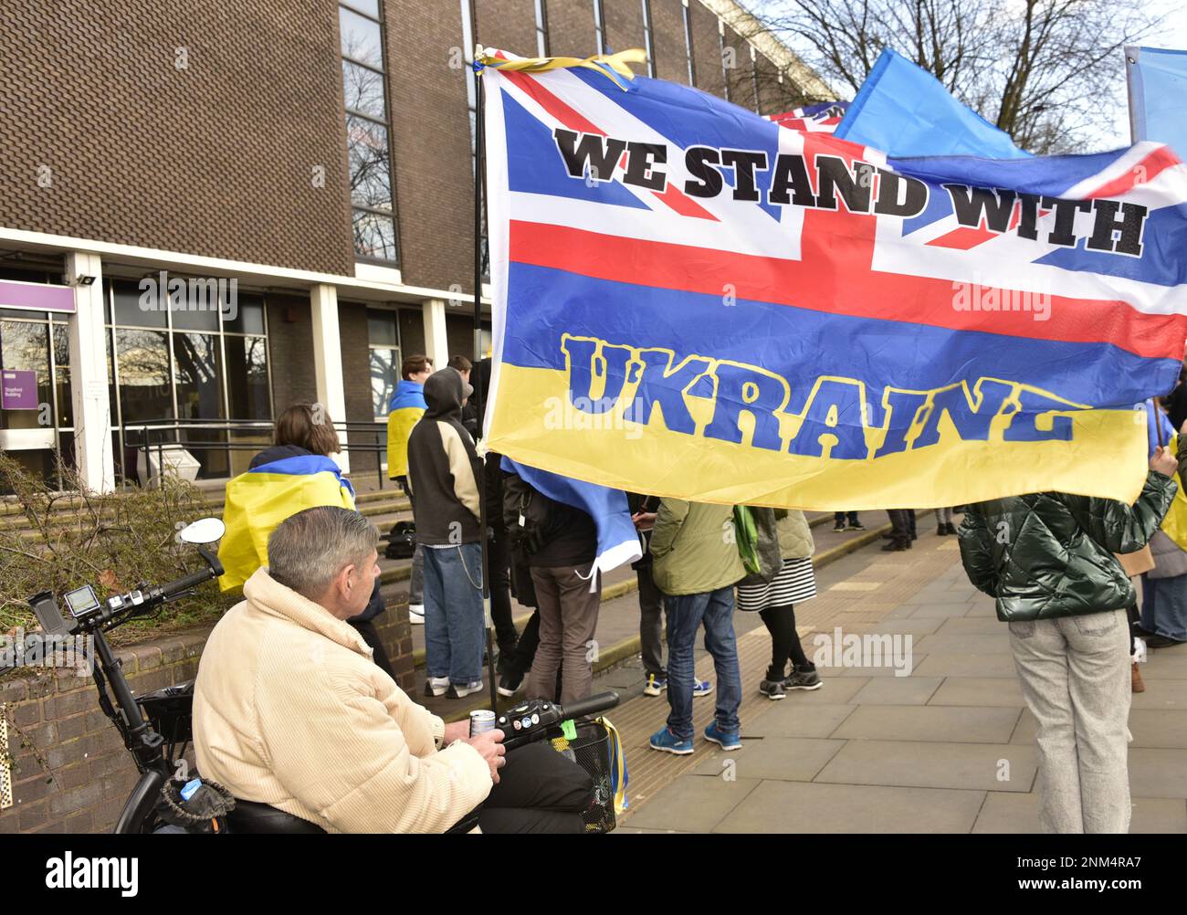 Manchester, UK, 24th February, 2023. A 'We stand with Ukraine' flag in ...