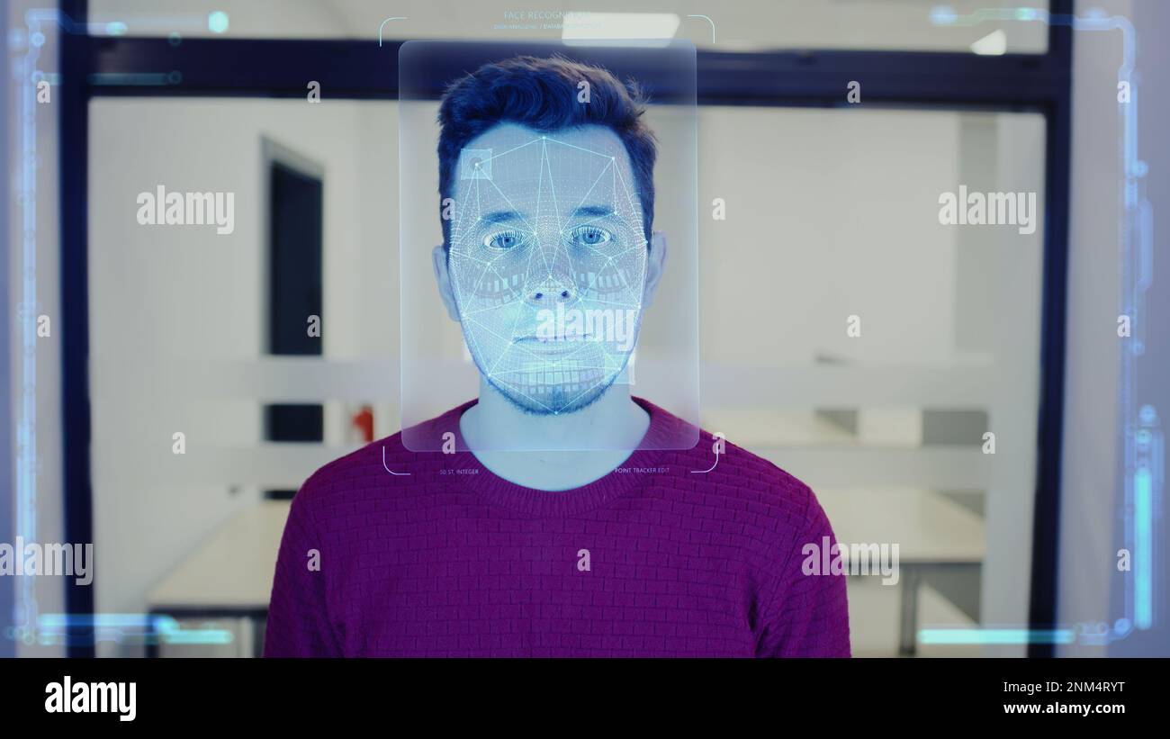 Man scans face in office. He touches sensor and security system ...