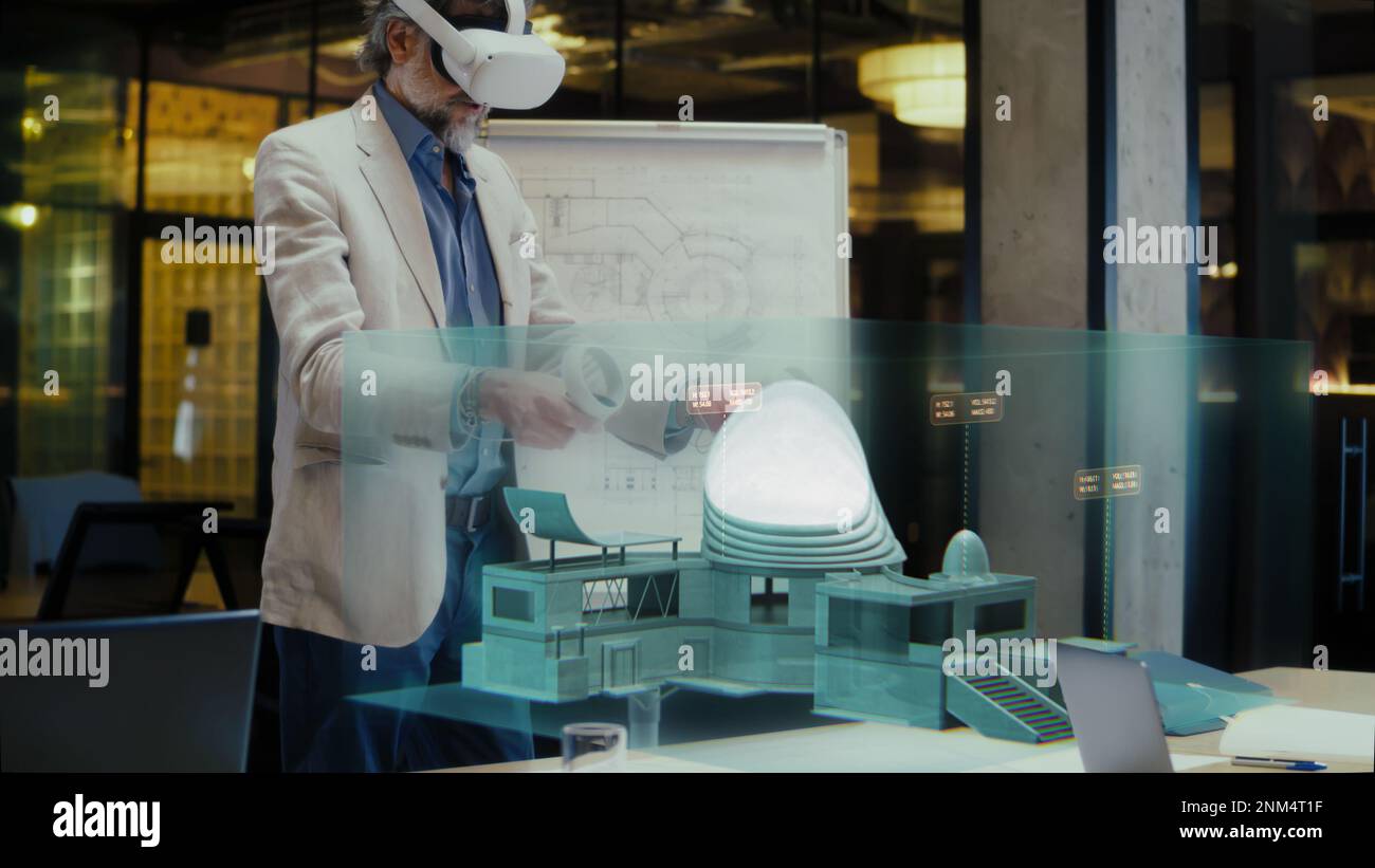 Architect designer in VR goggles presents new architecture project in ...