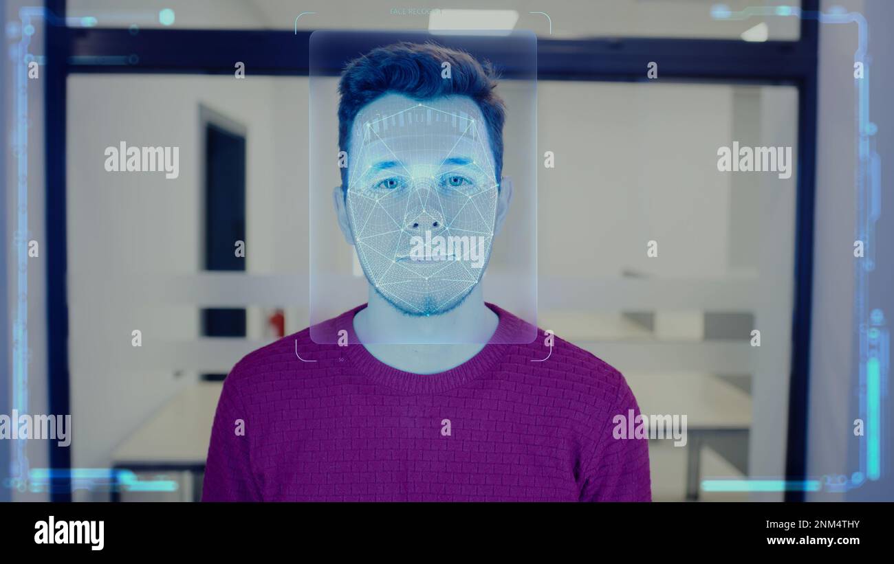 Man scans face in office. He touches sensor and security system ...