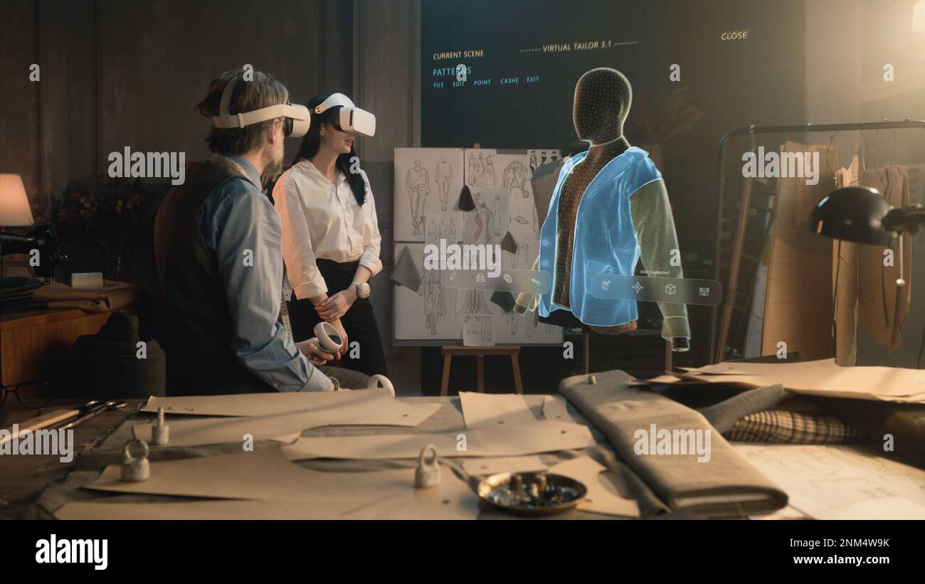 Tailor and female customer put VR goggles in atelier workshop. 3D ...