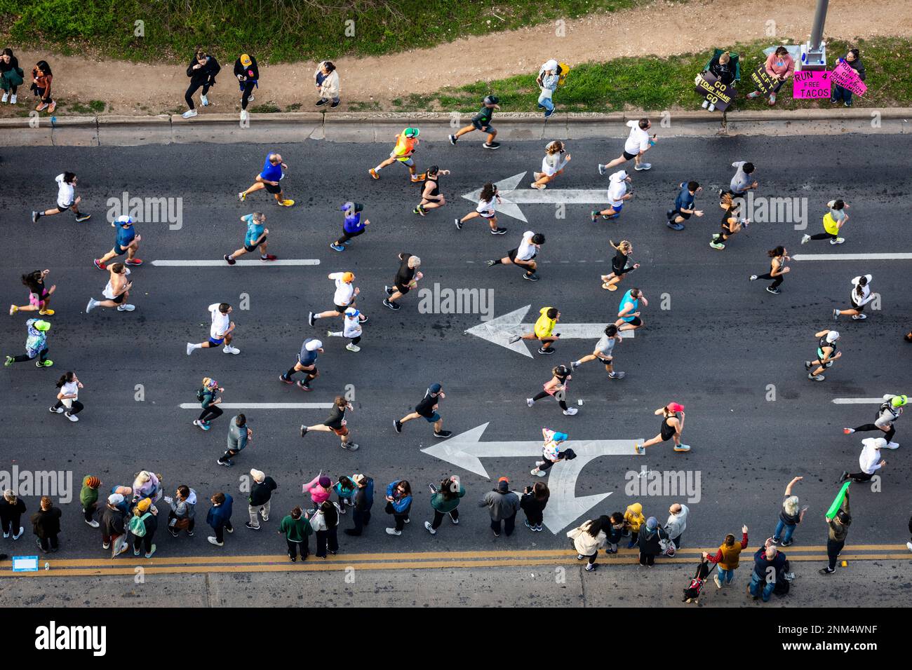 Overhead view of Austin marathon runners on Cesar Chavez Avenue in ...