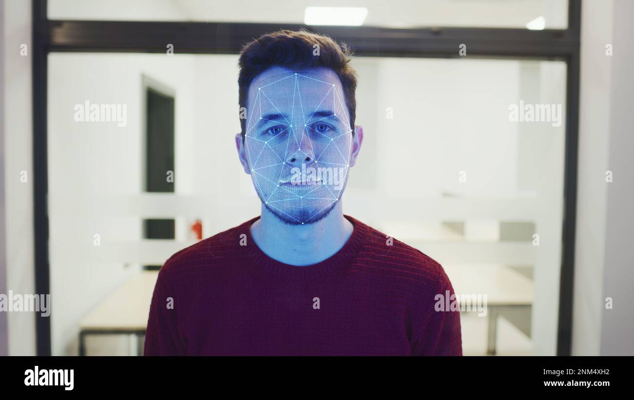 Man scans face in office. He touches sensor and security system ...