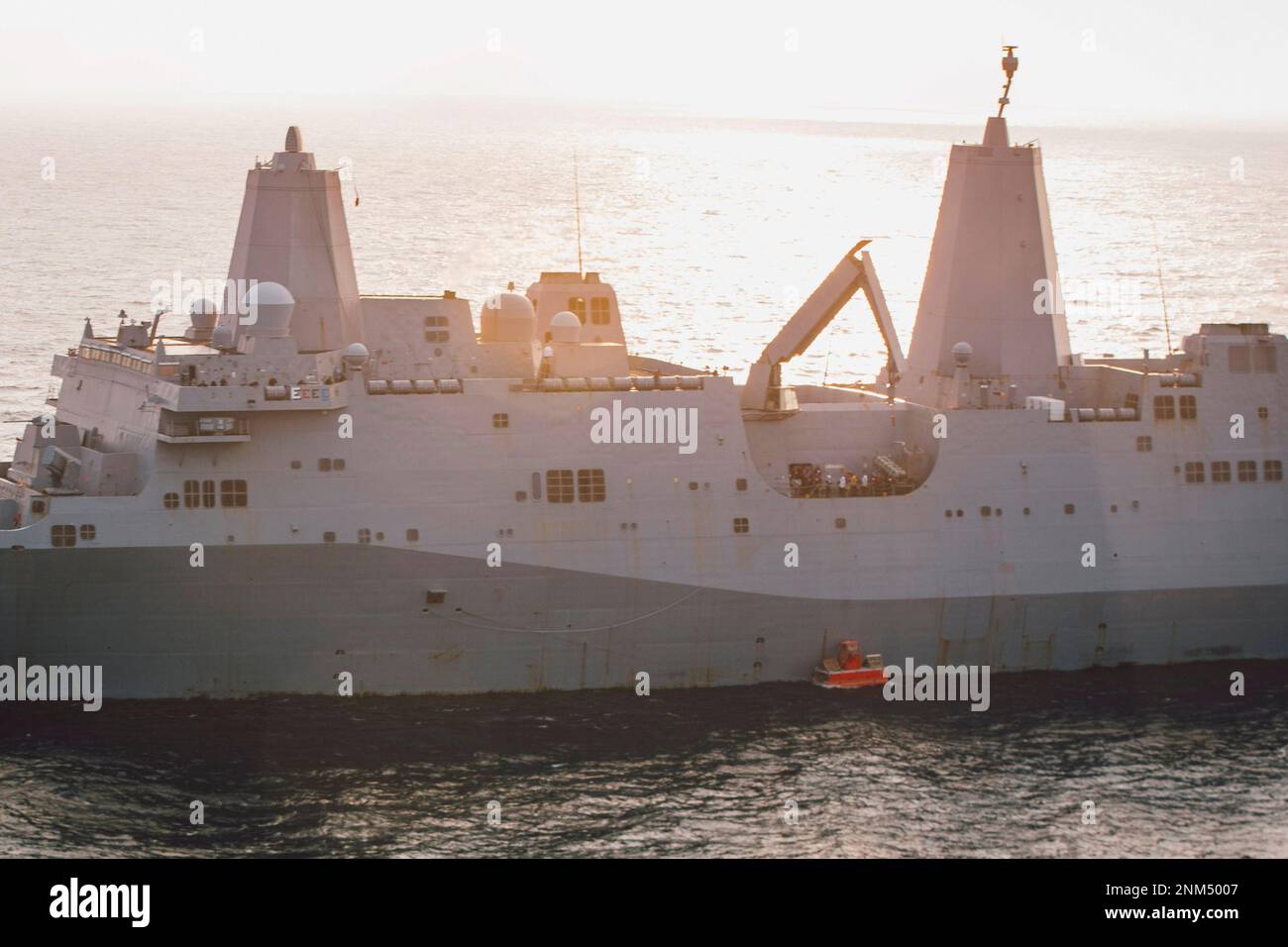 Amphibious transport dock ship USS Portland (LPD 27) lowers a static ...