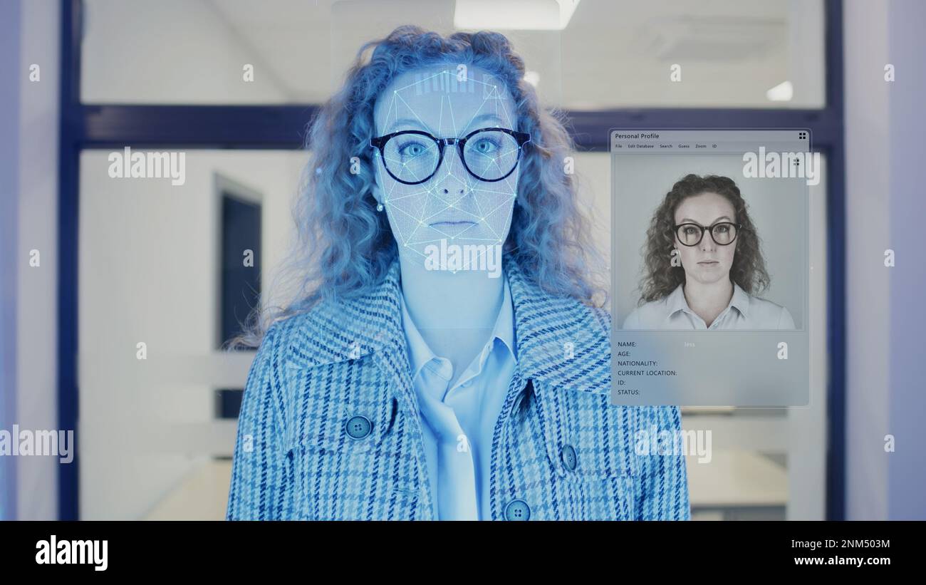 Woman scans face in office. She touches sensor and security system ...