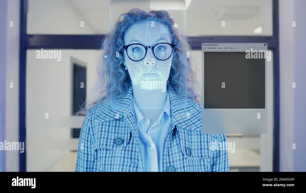 Woman scans face in office. She touches sensor and security system ...