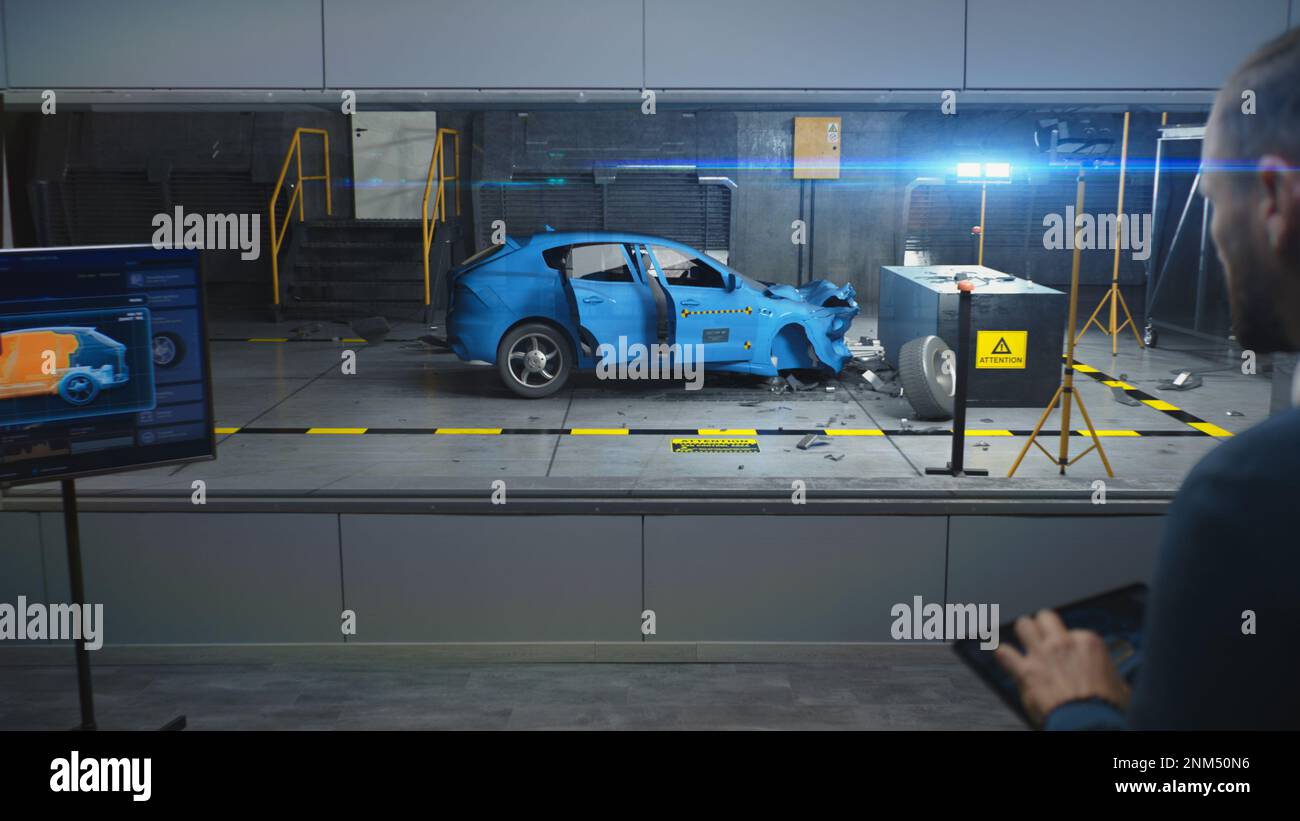 Male engineer simulates and watches process of traffic accident using ...