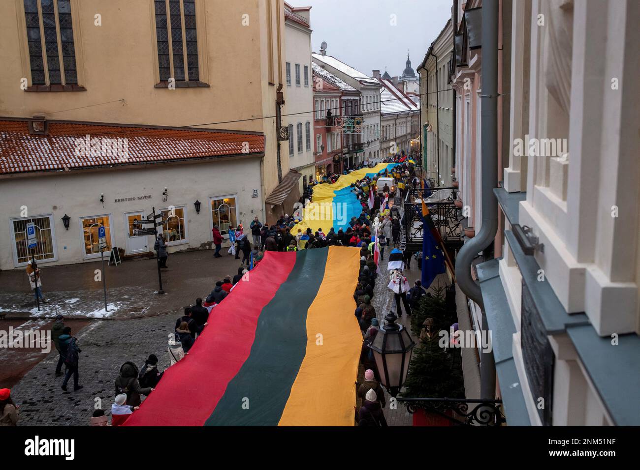 People carry giant Ukrainian and Lithuanian flags to mark the first ...
