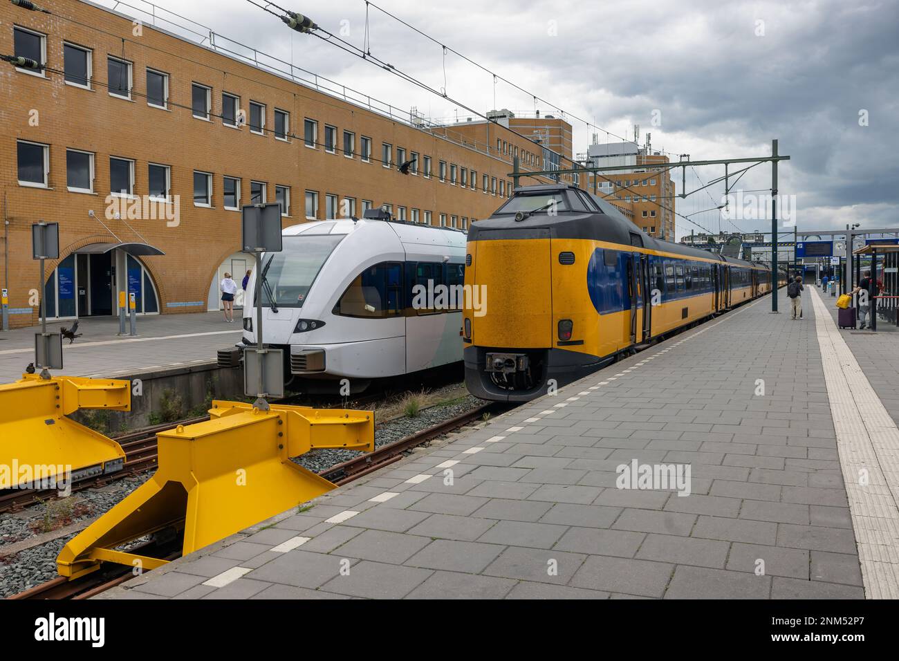 Railway platform with waiting trains ready for departure in Dutch city ...
