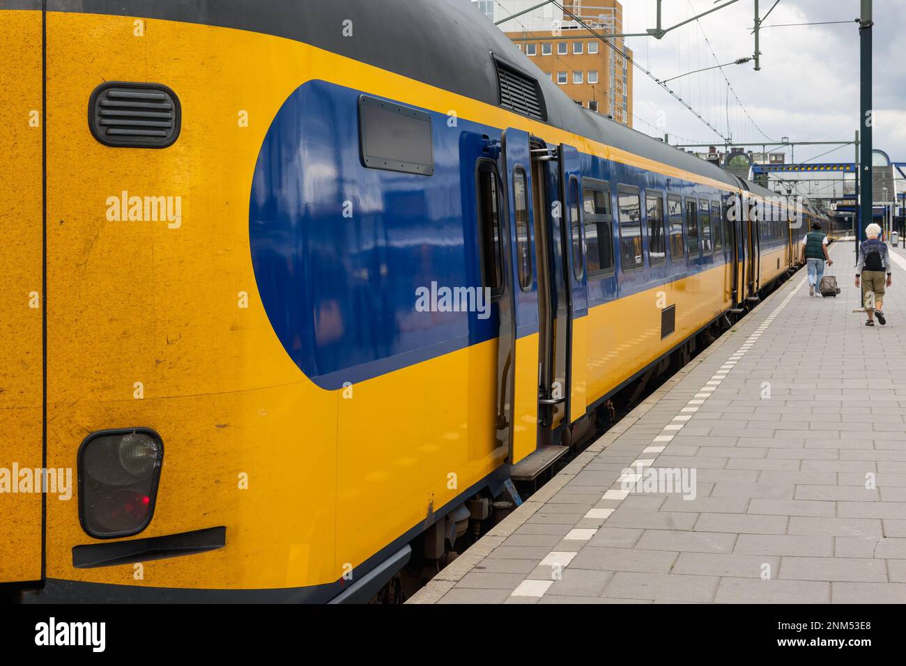 Railway platform with waiting train ready for departure in Dutch city ...