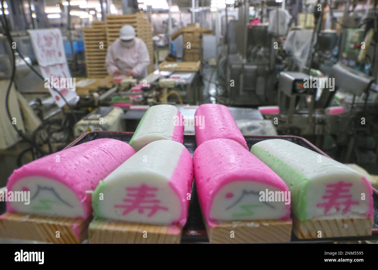 Workers make Kamaboko precessed fish paste for Osechi, Japanese ...