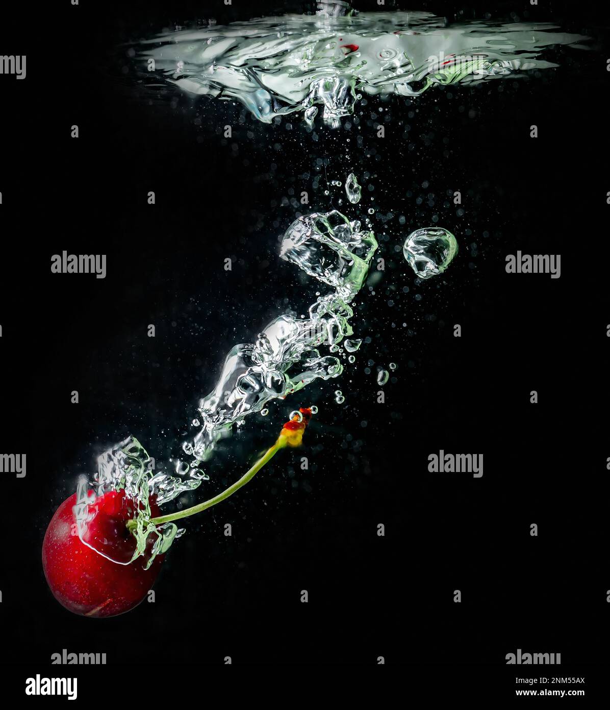 Cherry cherries splash water motion hi-res stock photography and images ...