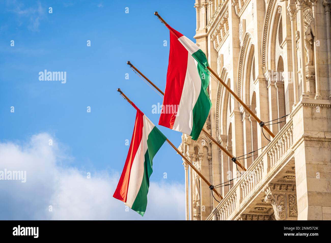 Hungary National flags. Two Hungarian flags on flagpole hanging on a ...