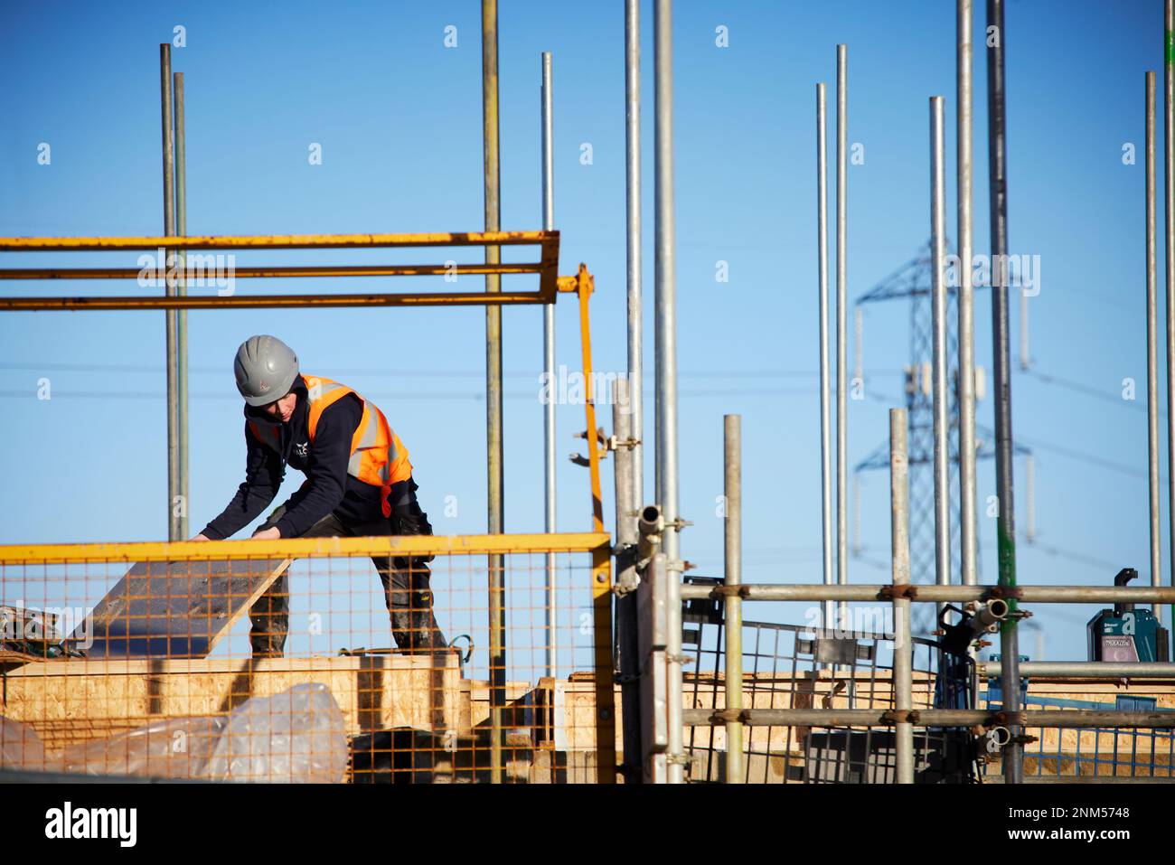 Construction worker building new homes on site Stock Photo - Alamy