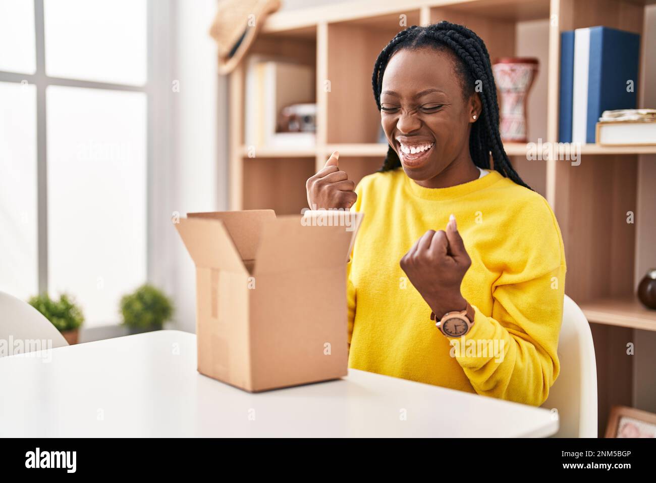 Woman and opening box and scream hi-res stock photography and images ...