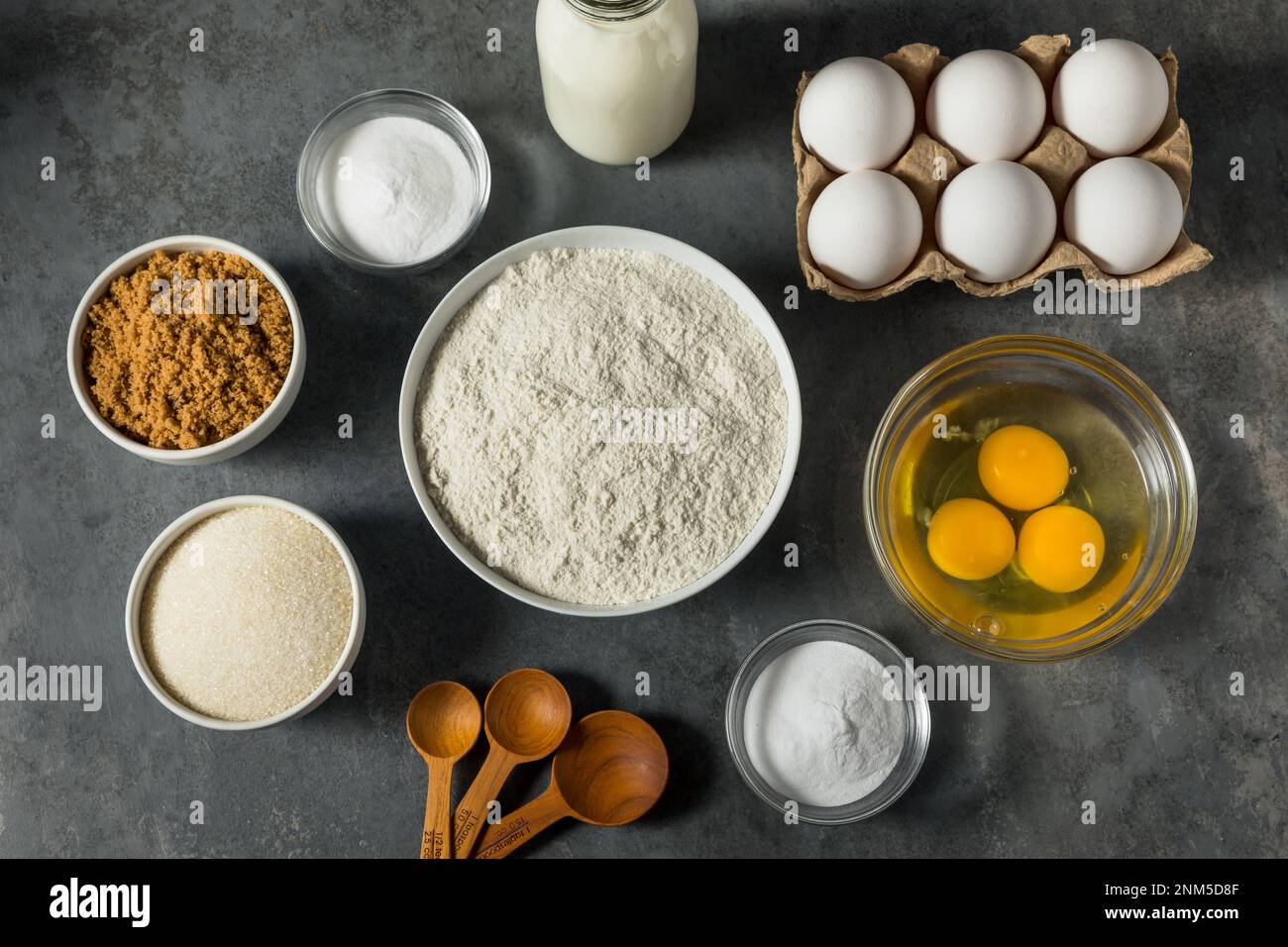 Organic Raw Baking Ingredients with Flour Sugar Milk and Eggs Stock ...