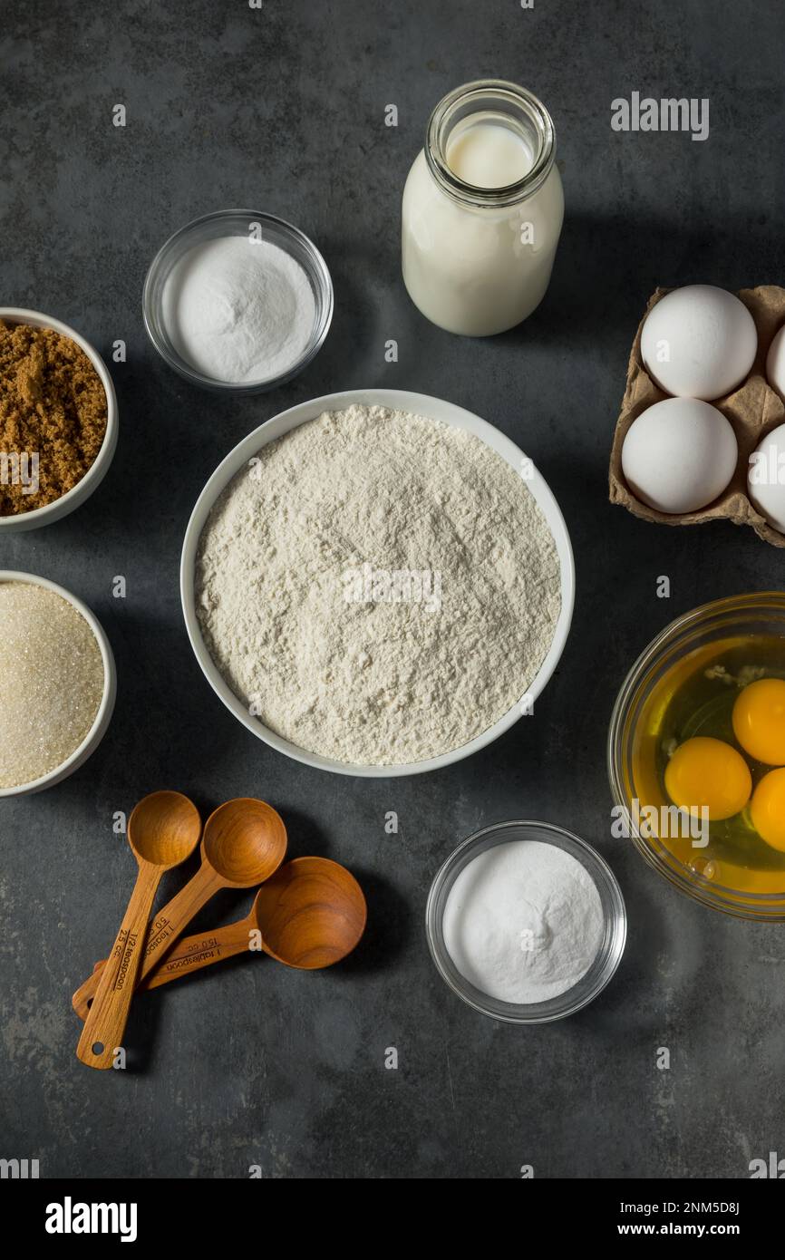 Organic Raw Baking Ingredients with Flour Sugar Milk and Eggs Stock ...