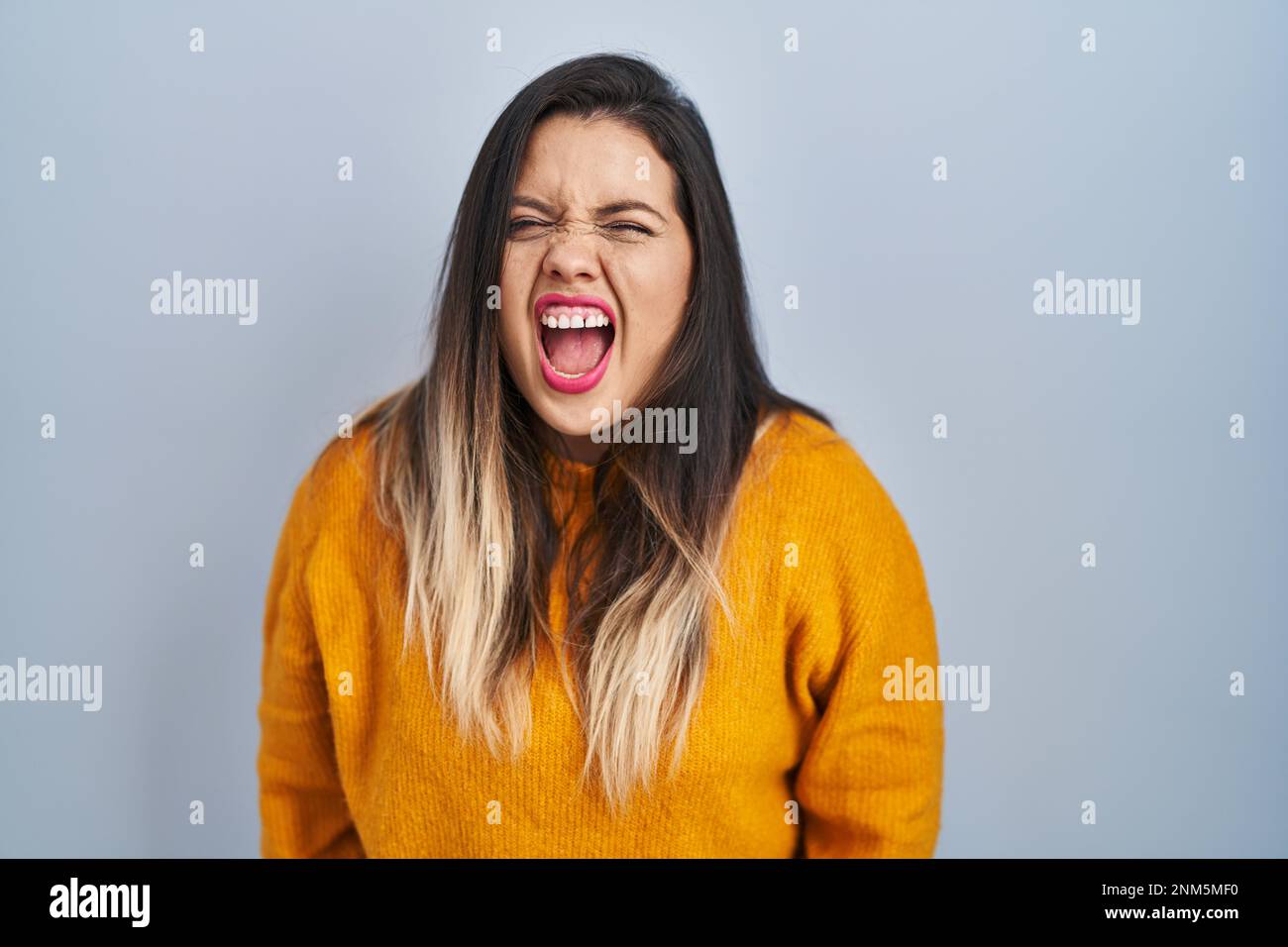 Young Hispanic Woman Standing Over Isolated Background Angry And Mad