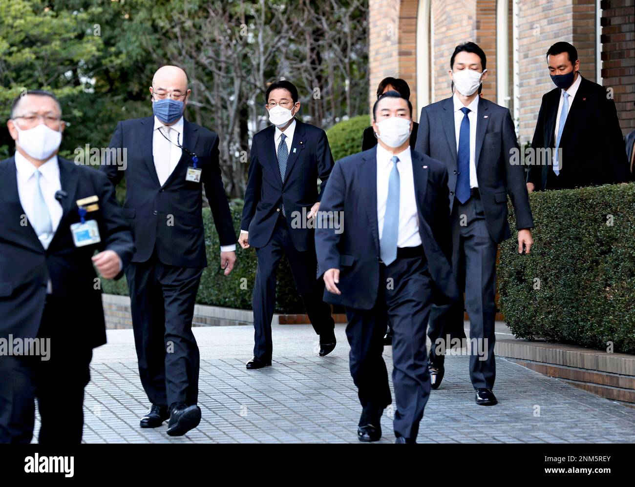 Japanese Prime Minister Fumio Kishida (C) walks to the prime minister's ...
