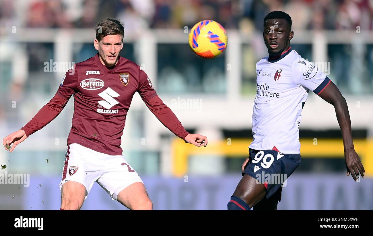 Torino's Dennis Praet, left, and Bologna's Musa Barrow battle for the ...