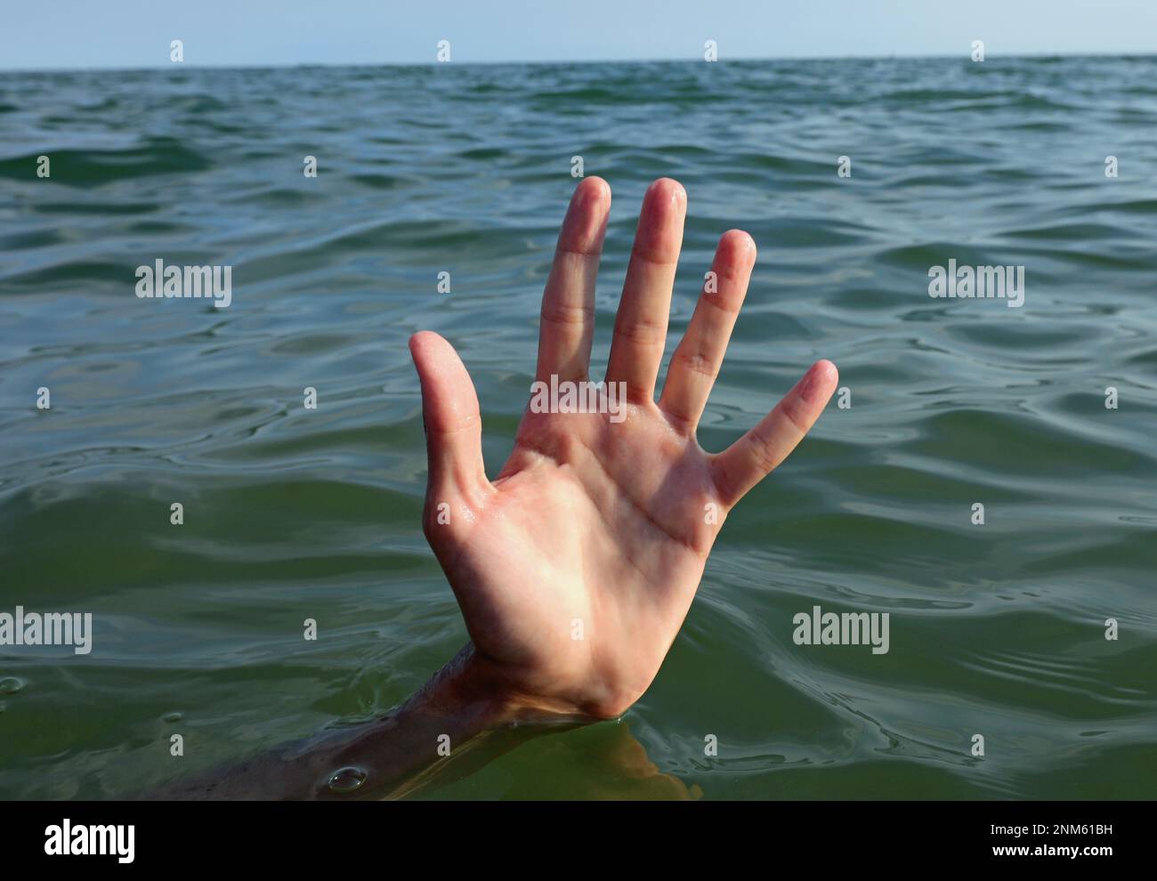 people hand while drowning and asking for help symbol of depression and ...