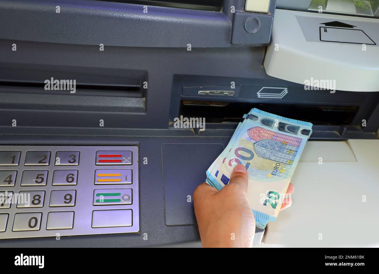 human hand with many european banknotes at ATM Stock Photo - Alamy