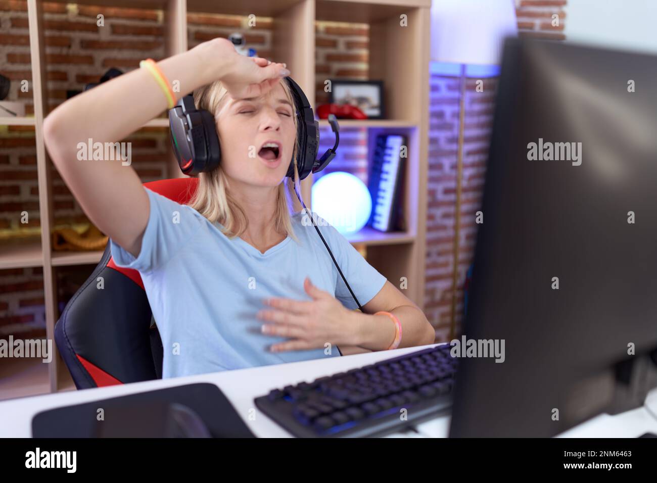 Tired female gamer playing video games hi-res stock photography and ...