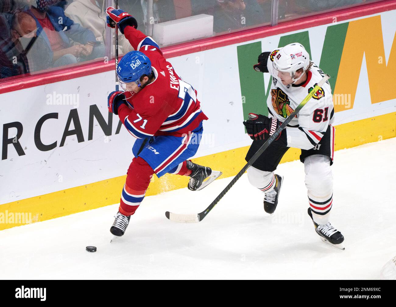 Chicago Blackhawks' Riley Stillman, right, loses his stick as he ...
