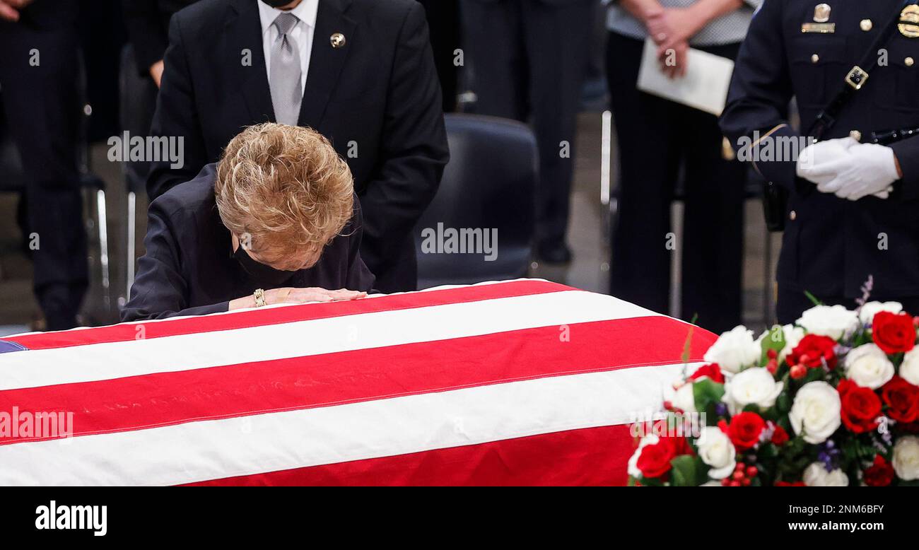 Former Sen. Elizabeth Dole cries at the casket of her husband, former ...