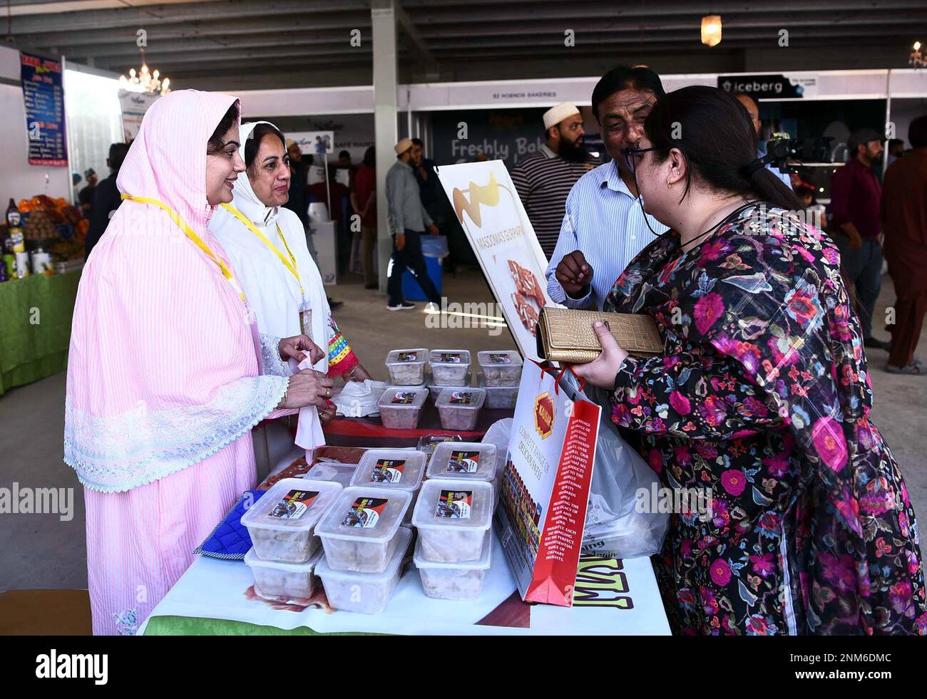 Visitors take keen interest at stall during the Bohra Food Festival ...