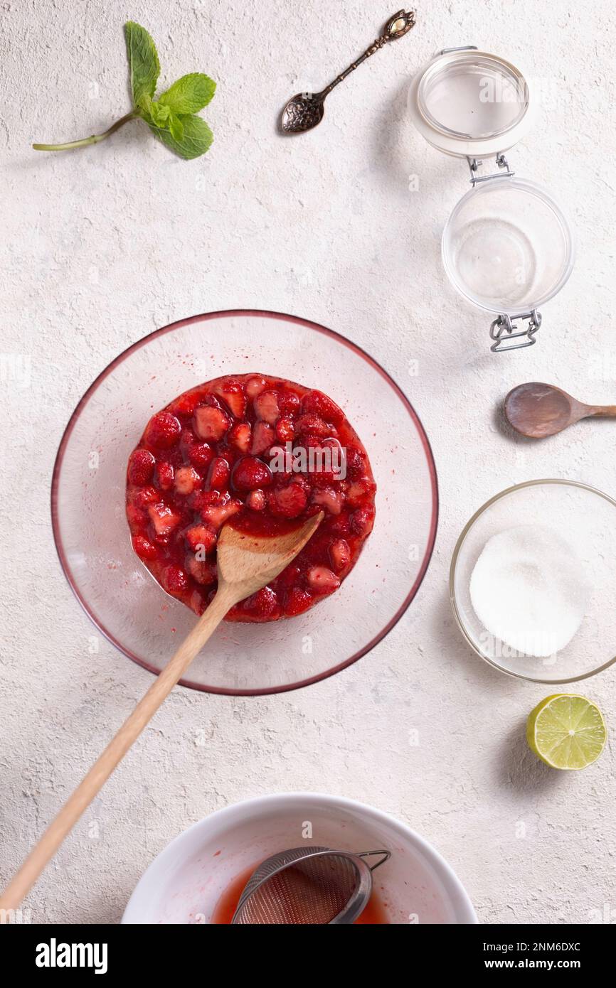 The process of making strawberry jam in the home kitchen, top view ...