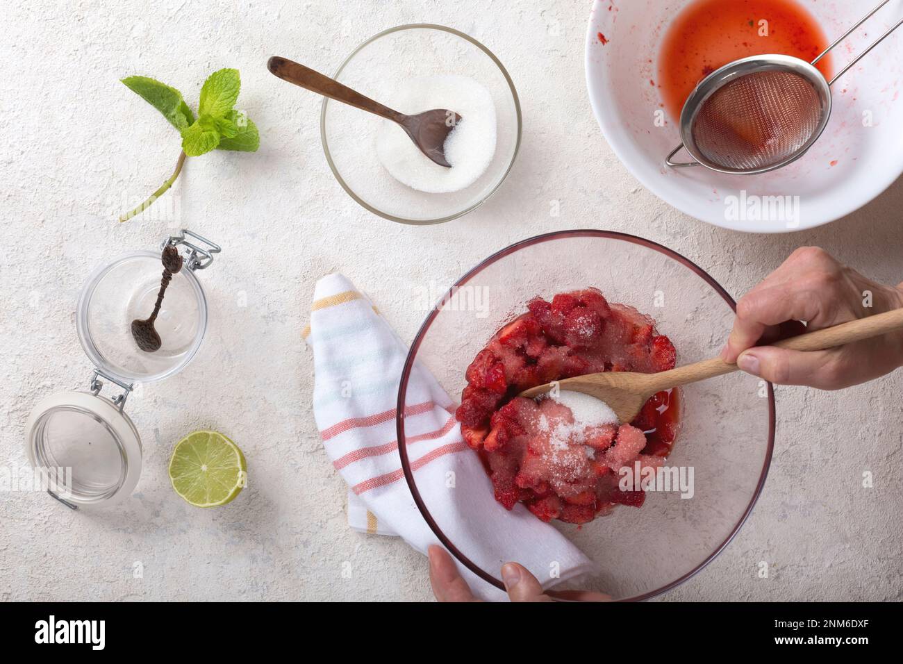 Woman preparing strawberry jam in her kitchen at home, top view Stock ...