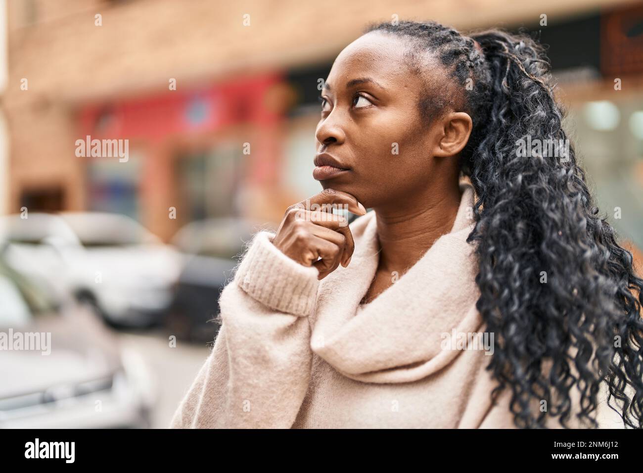 African american woman standing with doubt expression at street Stock ...