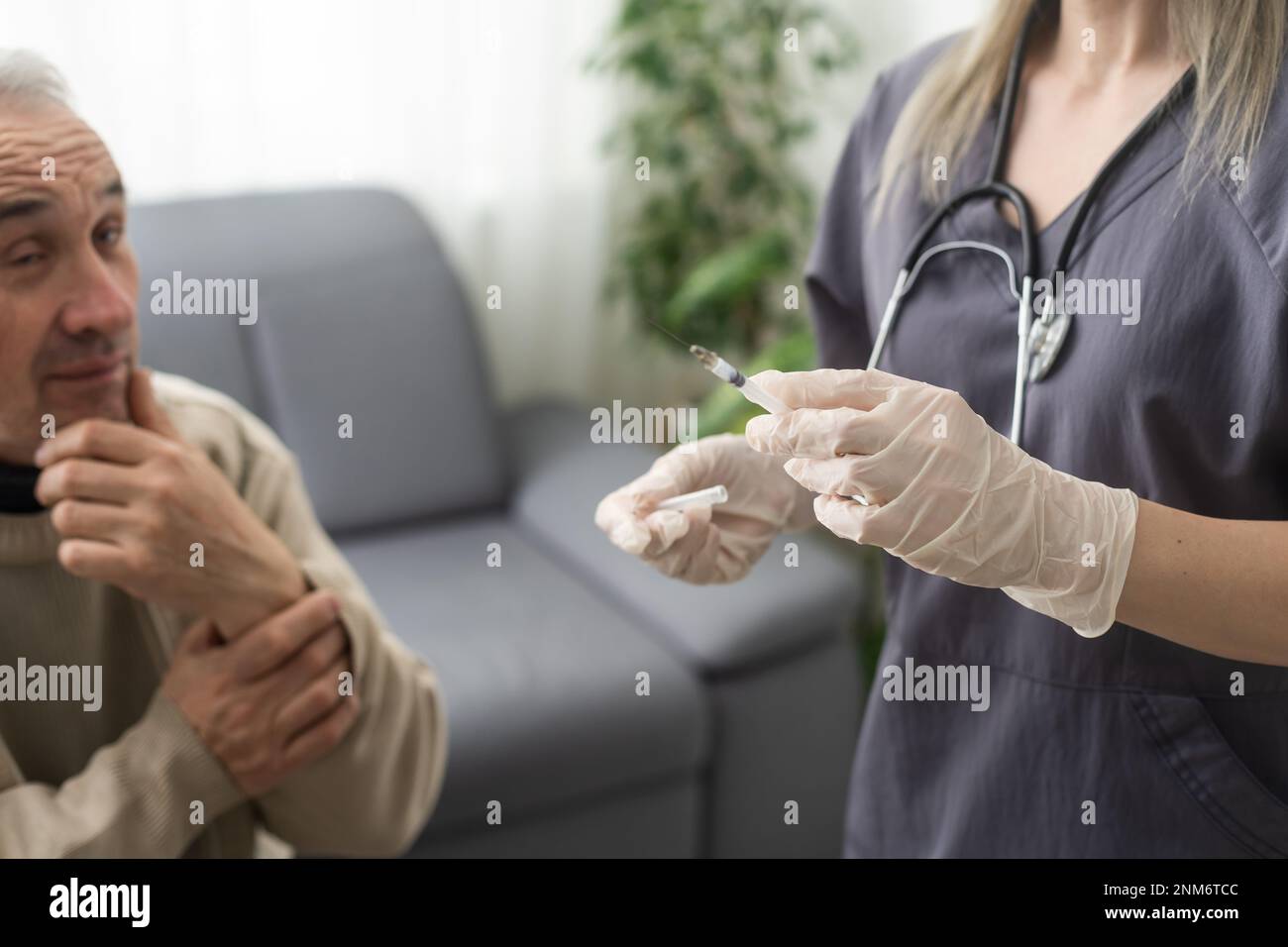 Woman getting vaccine home hi-res stock photography and images - Alamy