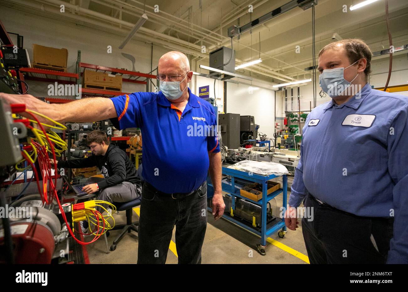 Hawkeye Community College instructor Dan Utley demonstrates the motor ...