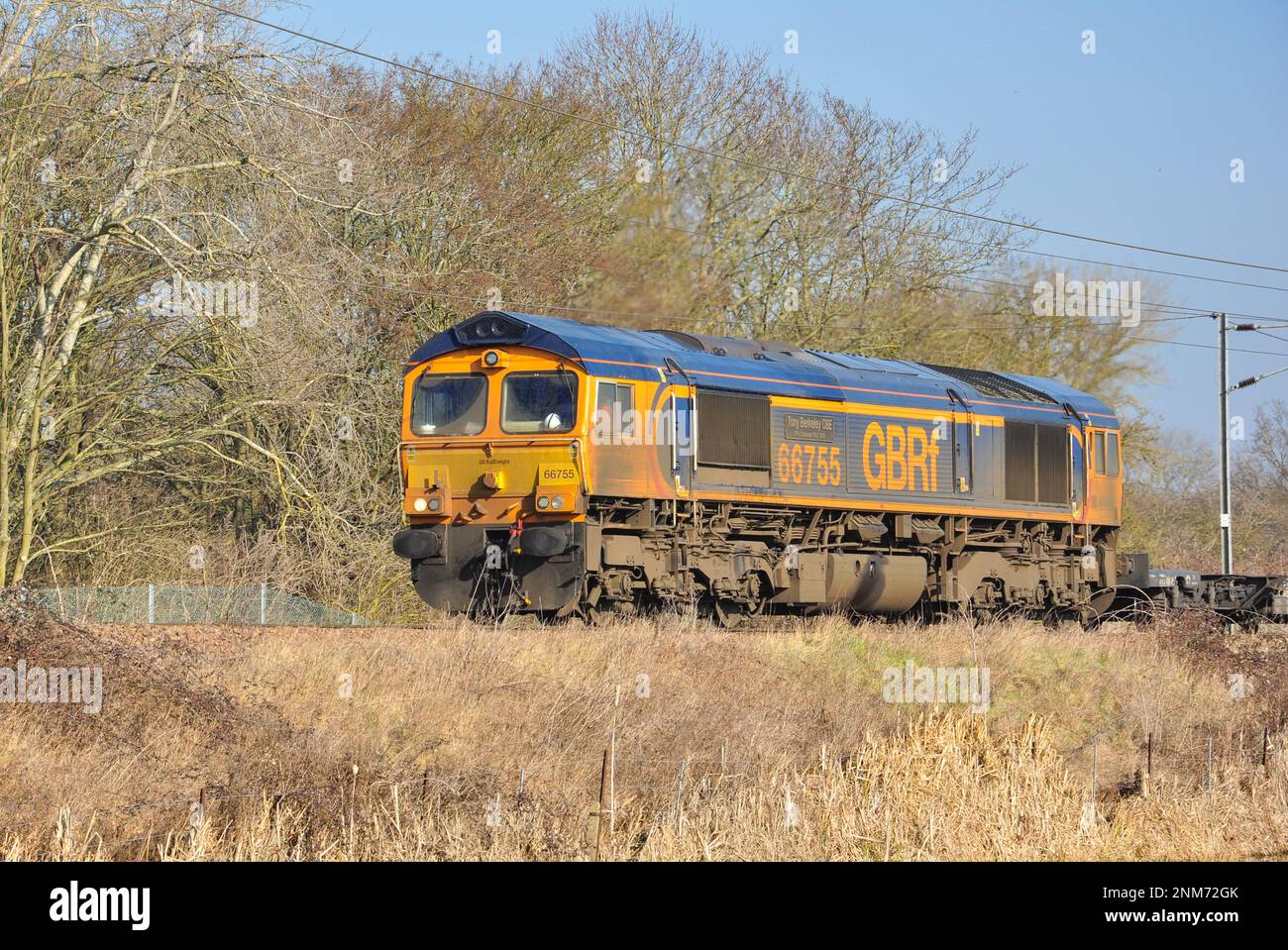 Class 66 locomotive heads container wagons south towards Ely ...