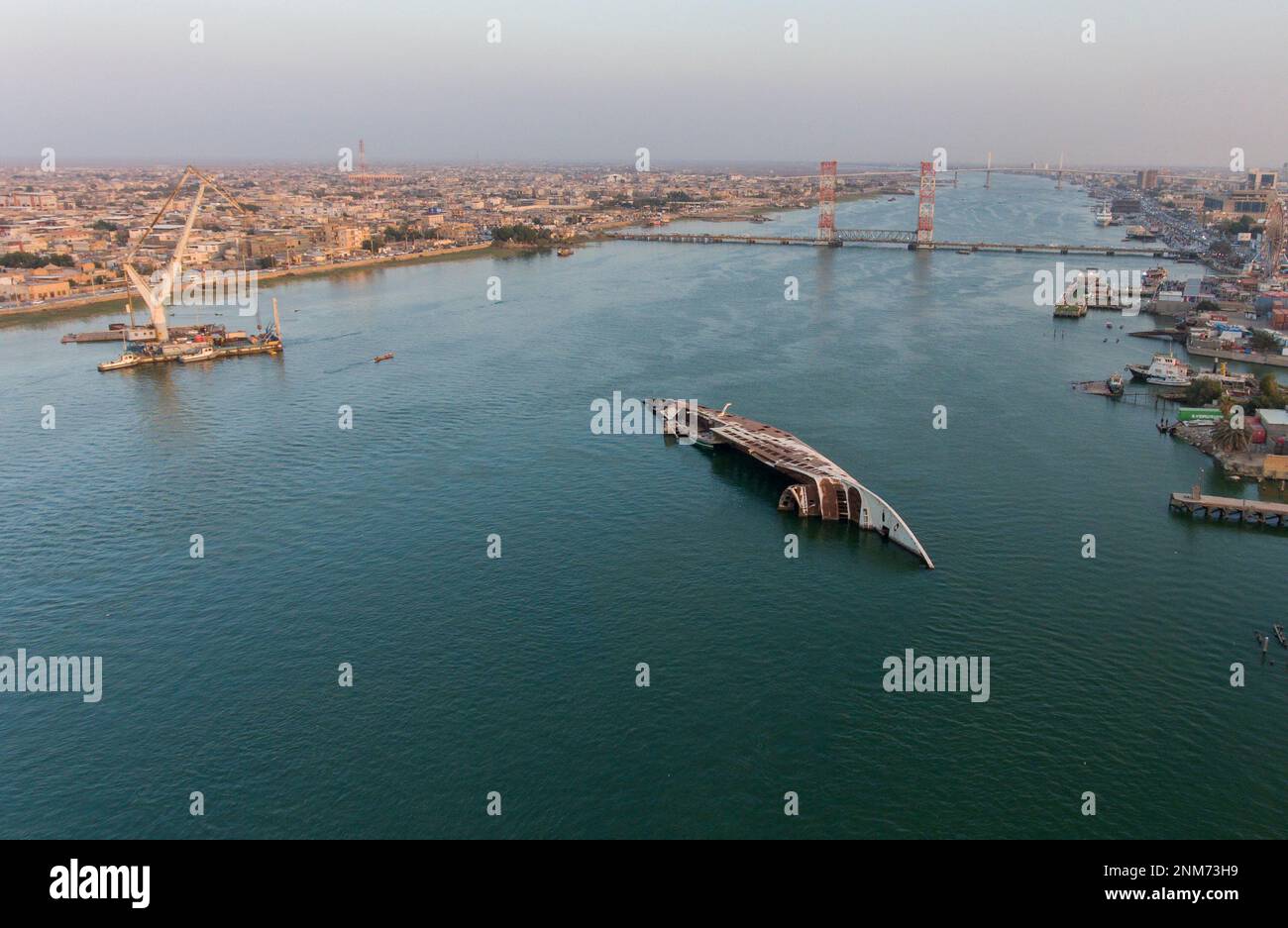 This aerial photo shows the capsized hull of "Al Mansur, the private ...
